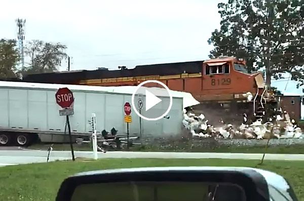 Watch Train Slams Into Tractor-Trailer That Is Stuck On The Tracks - ThrottleXtreme