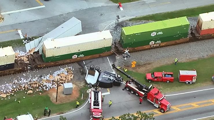 Watch Train Slams Into Tractor-Trailer That Is Stuck On The Tracks - ThrottleXtreme